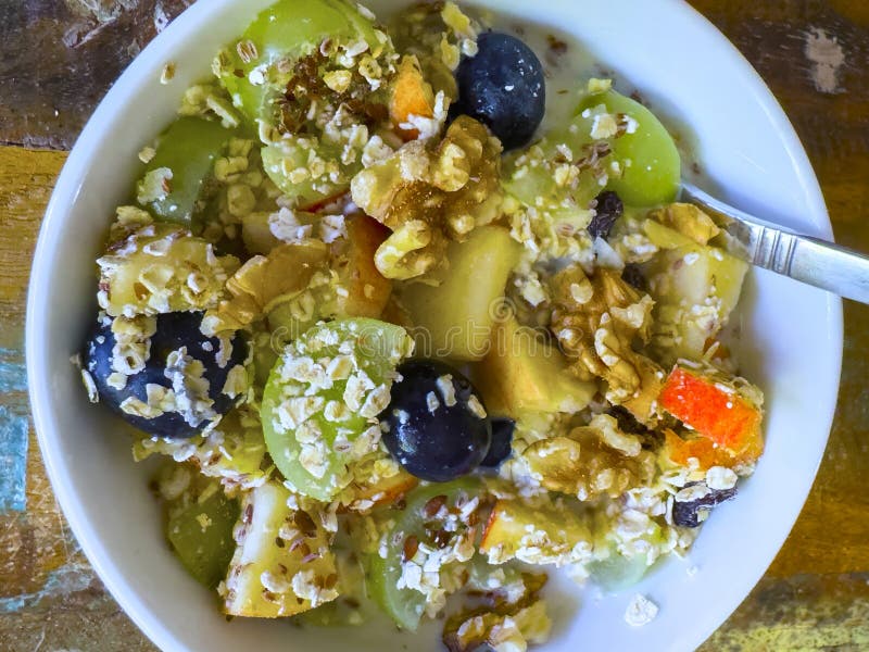 Bowl Full of Muesli with Oat Flakes, Various Types of Fruit and Walnuts ...