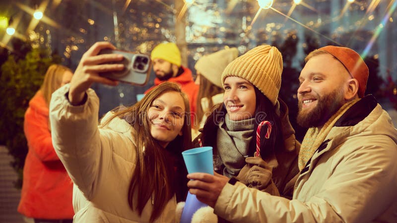 Cheerful Group of Friends Smiling while Capturing Selfie during Winter ...