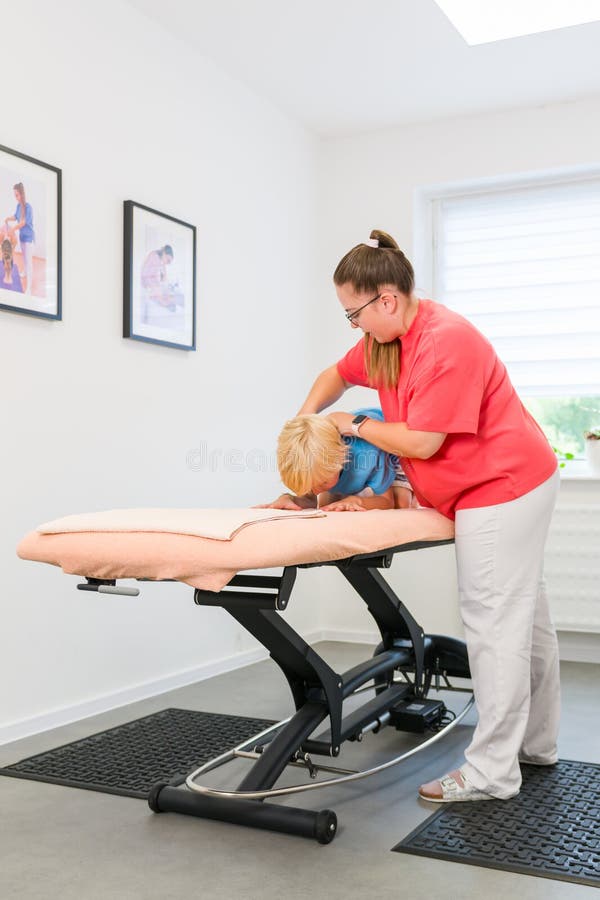 Child Physical Therapy. Young Boy Being Examined by a Chiropractor ...