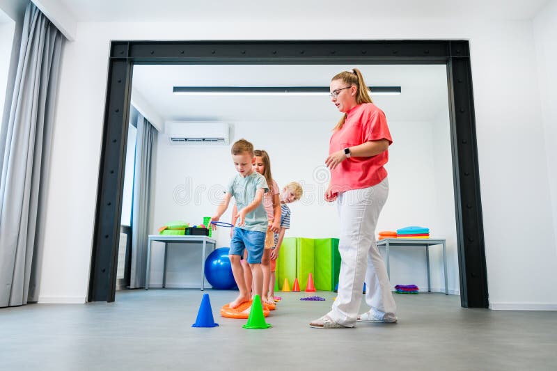 Children and Physical Therapist during Physical Therapy Session. Kids ...