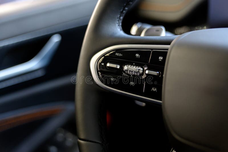 A Close-up of a Modern Car S Steering Wheel with Control Buttons Stock ...