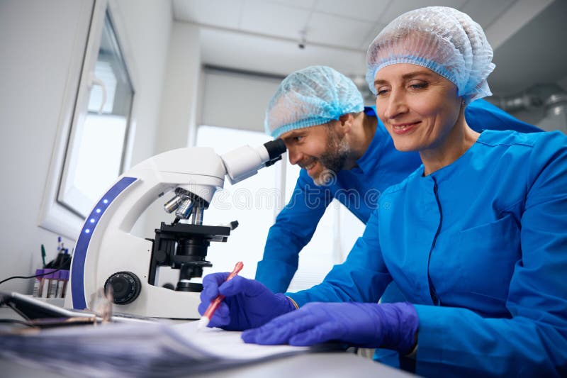Colleagues Laboratory Assistants at the Workplace in a Modern ...