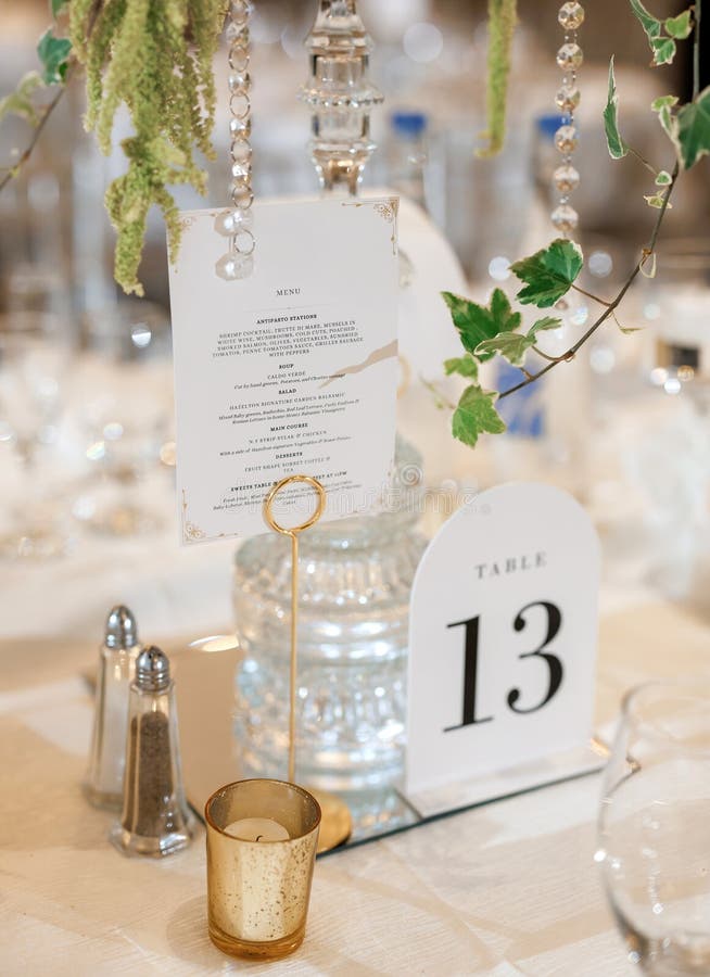 Detail of a Set Table with Menu, Table Number, Salt and Pepper Shaker ...