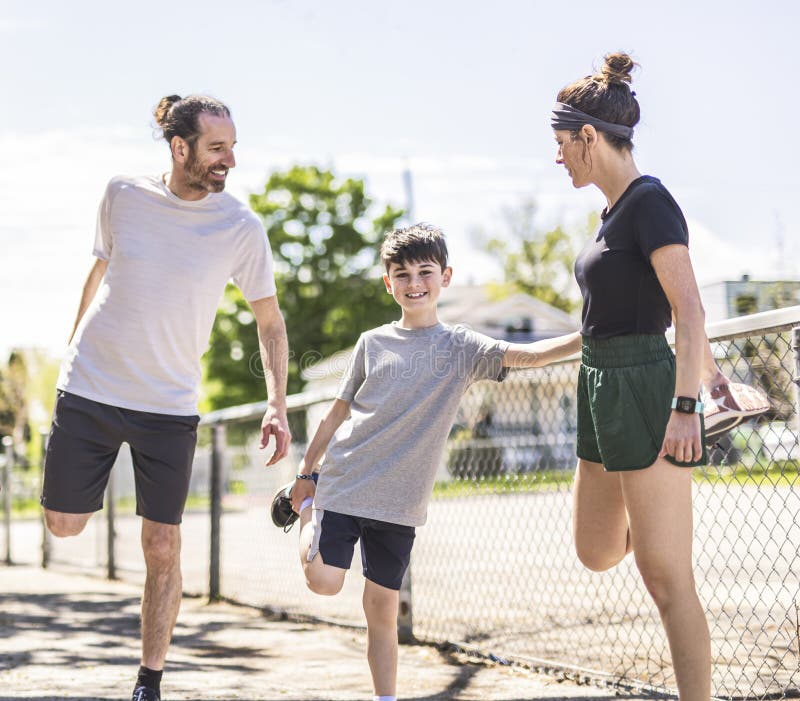 Brother and Sister Jogging in Green Park on a Sunny Summer Evening ...