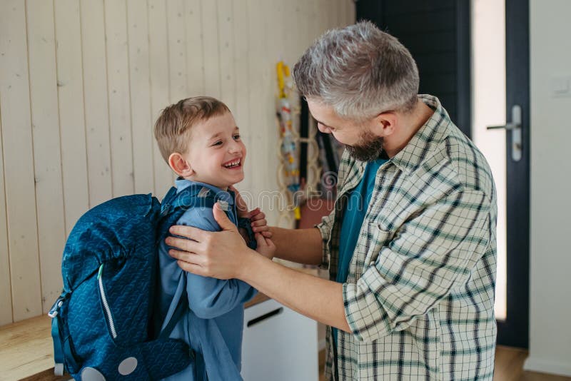 Father Helping Son Get Ready for Kindergarten, Preschool. Putting ...
