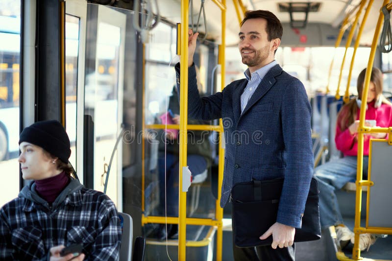 Focus on Smiling Man in Jacket Using Public Transport, Modern Tram for ...