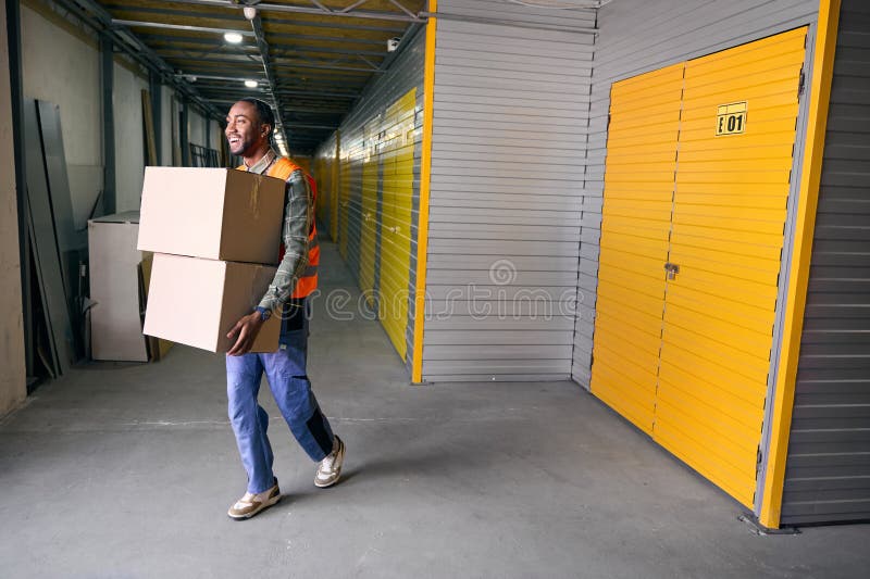 Joyful Loader Working in Modern Warehouse Facility Stock Image - Image ...