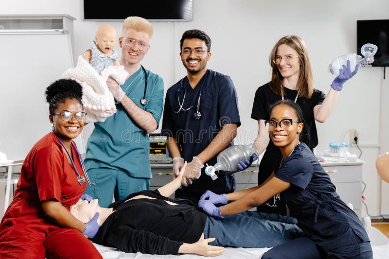 A Group of Medical Students Practice CPR on a Mannequin during a ...