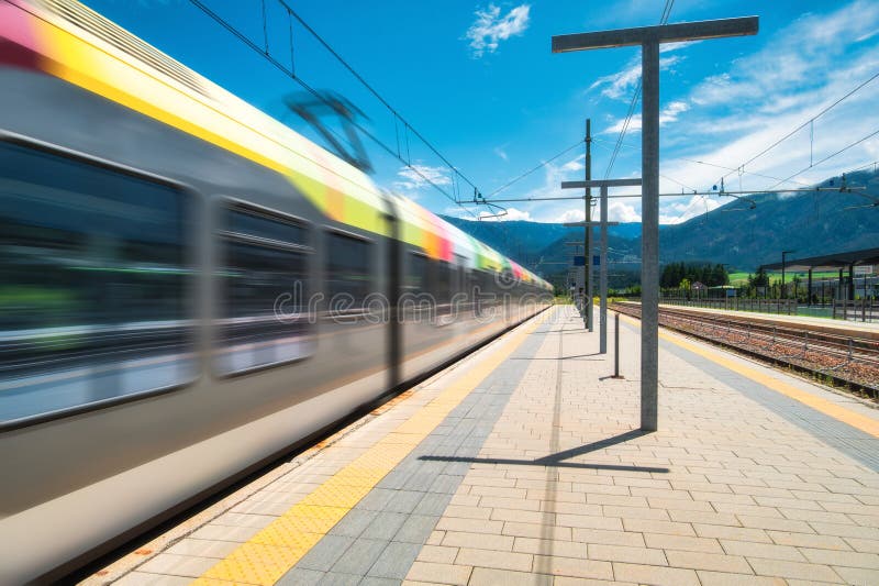 High-speed Passenger Train Moving at Railway Station Platform Stock ...