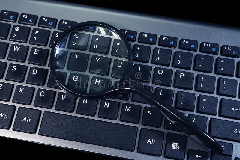 A Magnifying Glass on La Computer Keyboard. Stock Image - Image of ...