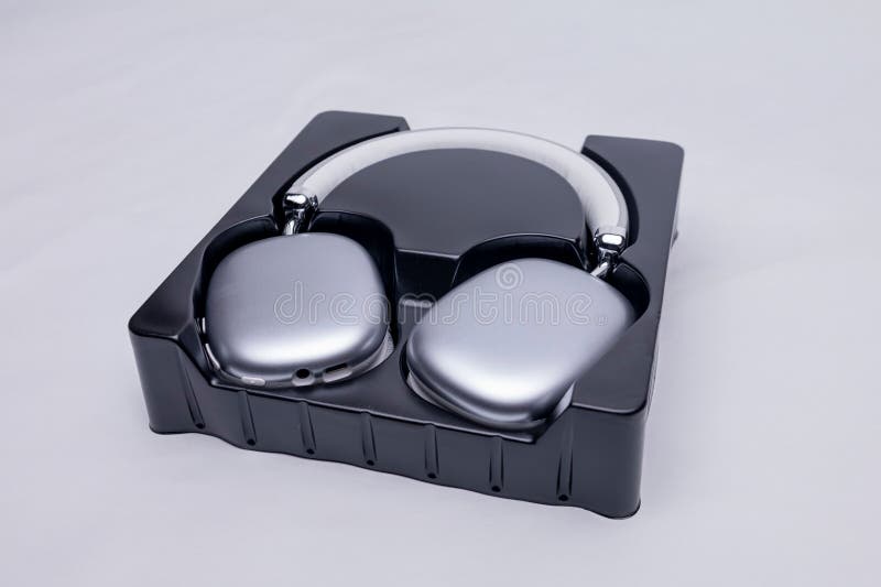 Wireless Headphones Resting in Packaging on Grey Background Stock Image ...