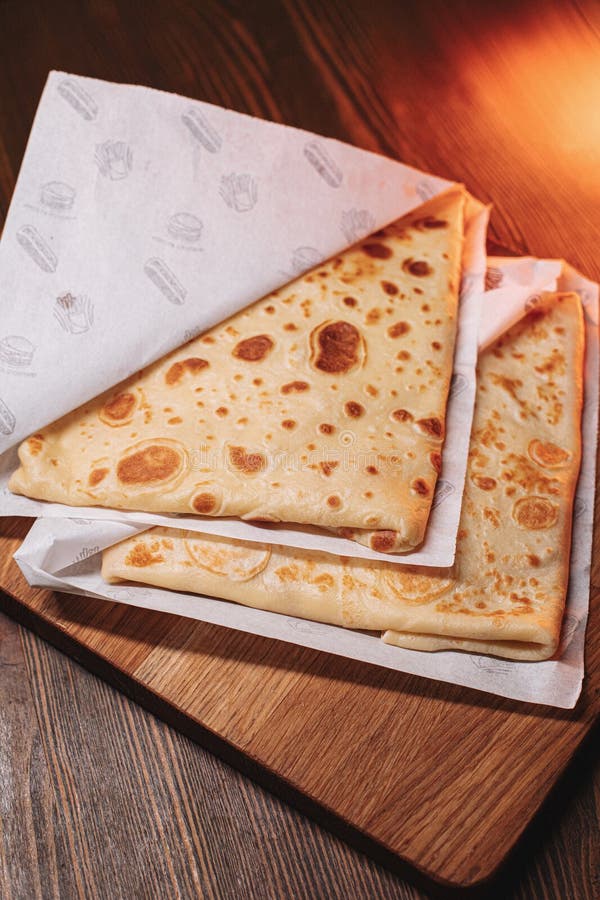 Thin Pancakes with Ham and Cheese in an Envelope are Placed on a ...