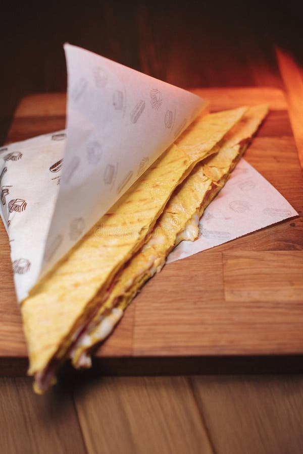 Thin Pancakes with Ham and Cheese in an Envelope are Placed on a ...