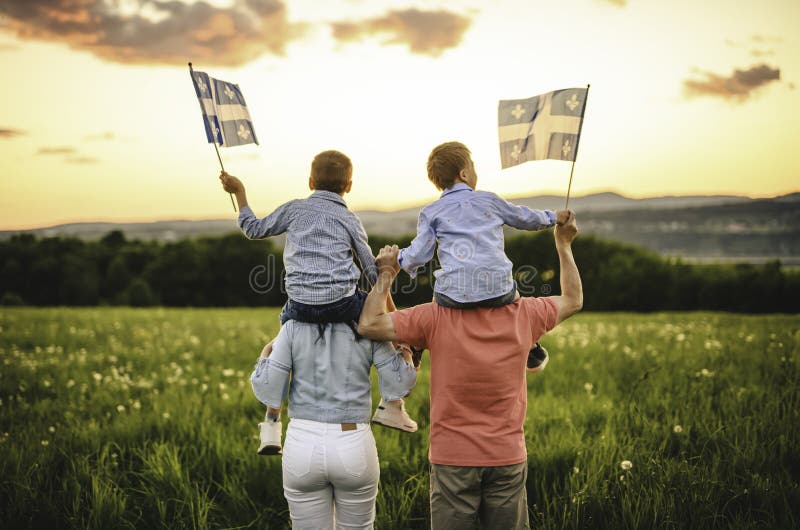 A Patriotic Family Waving Quebec Flags on Sunset Stock Image - Image of ...