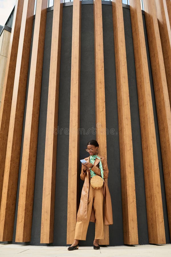Reading Magazine while Standing Against Modern Building Stock Image ...