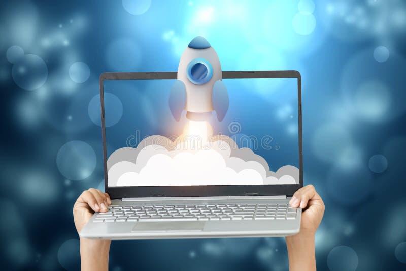 A Person is Holding a Laptop with a Rocket on the Screen. the Rocket is ...