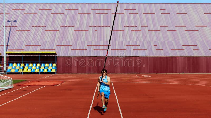 Pole Jump Athlete, Young Focused Man in Blue Uniform on Stadium Track ...