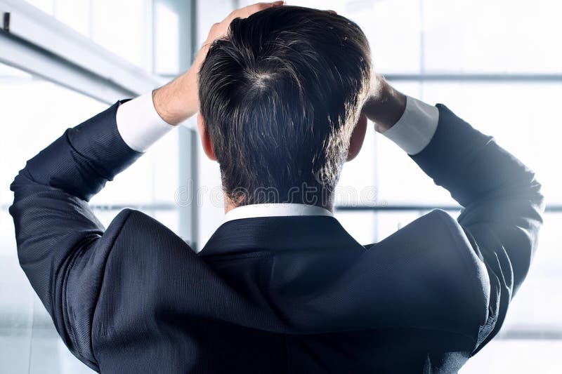 Generated Image Scene of a Man in a Suit Holding His Head Down at Work ...