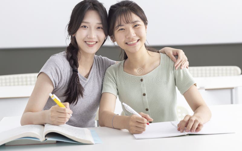 Smiling Teenage Classmates during Lesson in Classroom Stock Photo ...