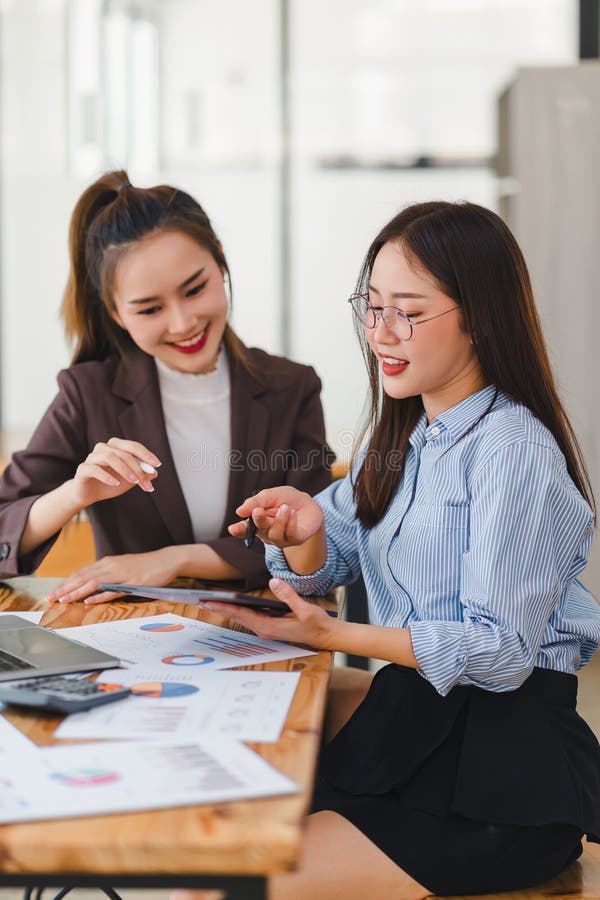 Two Colleagues Engaged in Business Analytics, Using Digital Tablets ...