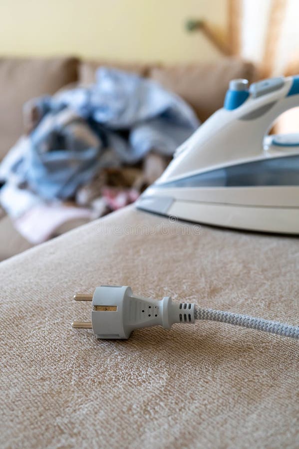 Iron for Wrinkled Clothes on Ironing Board in Room Stock Photo - Image ...
