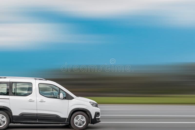 White Compact Van Drives Down the Street Stock Image - Image of ...
