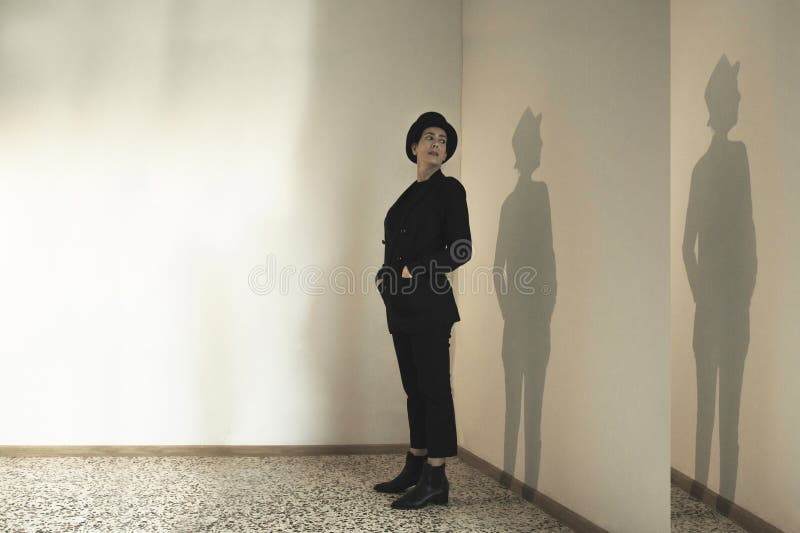 Woman Looking Back from Her Own Shadows, Fear Concept Stock Photo ...