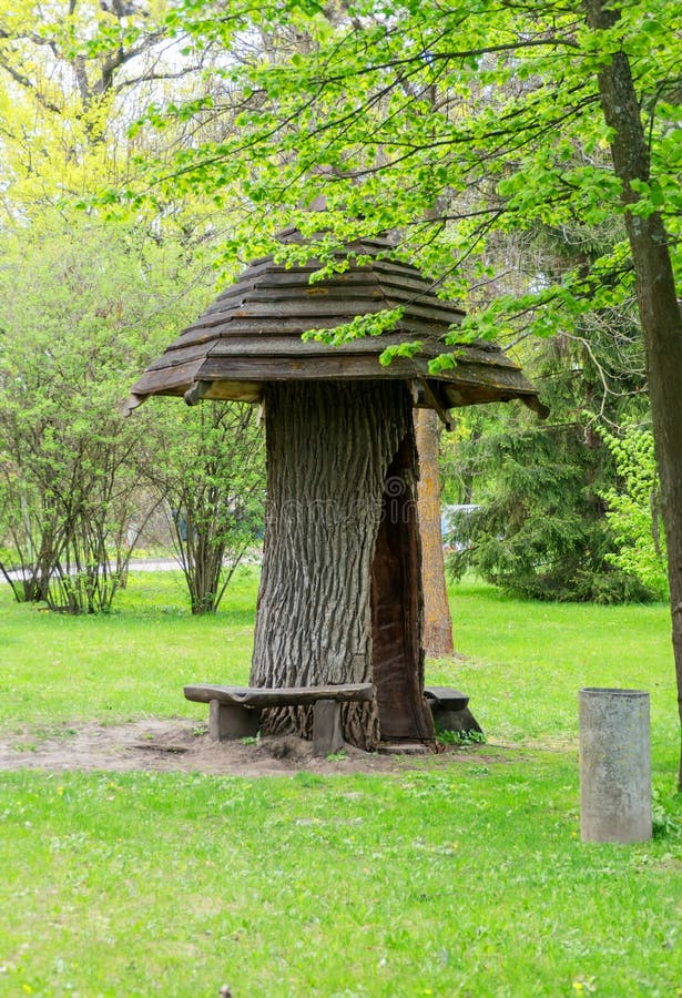 Wooden Gazebo in the Spring Forest Made in a Tree Trunk Stock Image ...