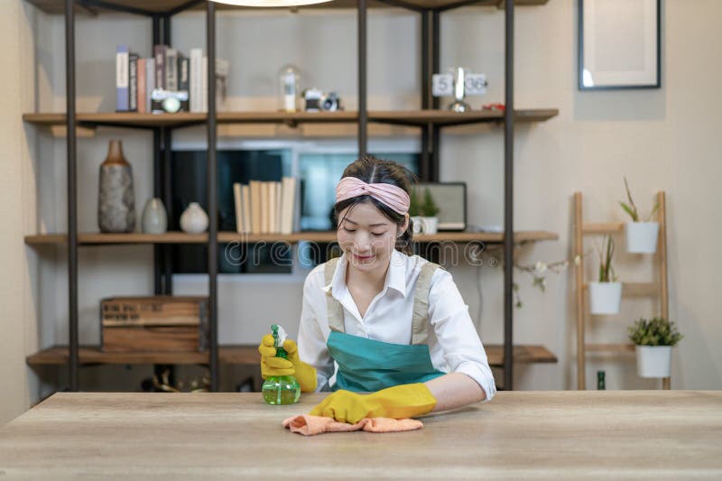 The Young Woman is Wiping Cleaning the Table Stock Photo - Image of ...