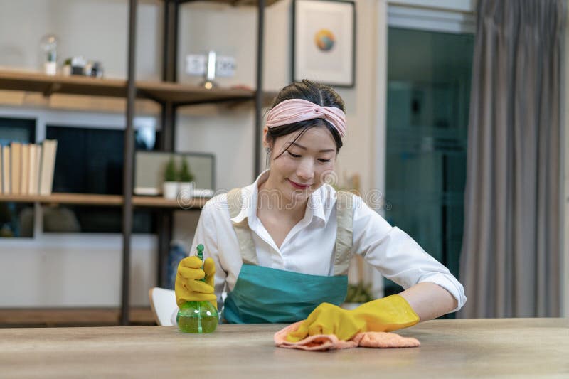 The Young Woman is Wiping Cleaning the Table Stock Image - Image of ...