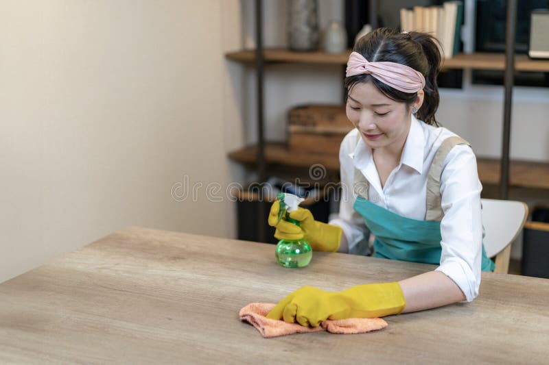 The Young Woman is Wiping Cleaning the Table Stock Photo - Image of ...