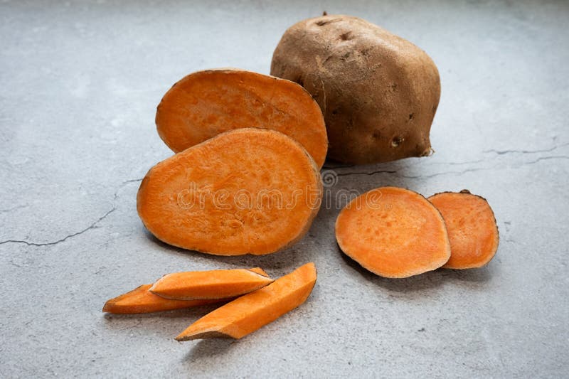 Generated ImaSweet Potato or Yam Roots, Both Whole and Sliced, Rest on ...