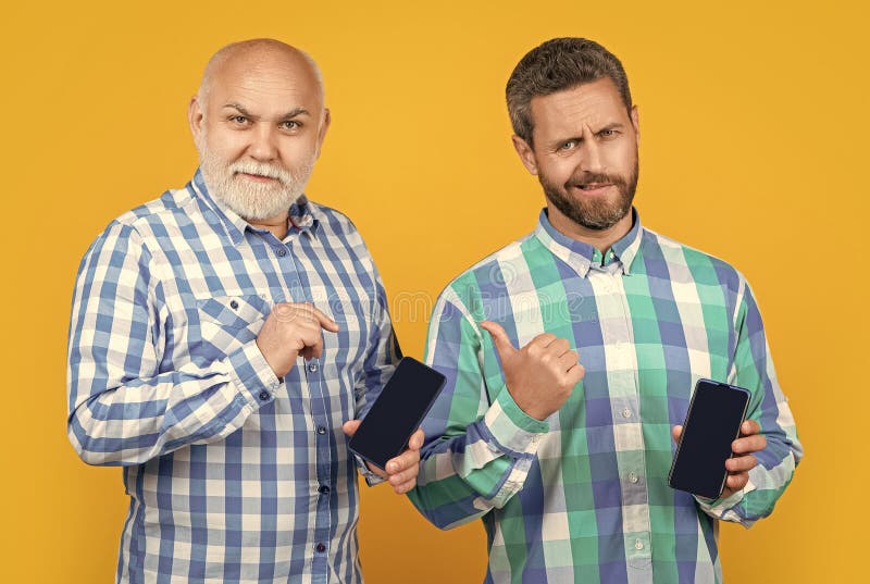 Generation Men Showing Phone App in Studio. Generation Men Showing ...