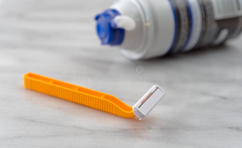 Generic Disposable Razor with Empty Can of Foam Stock Photo - Image of ...