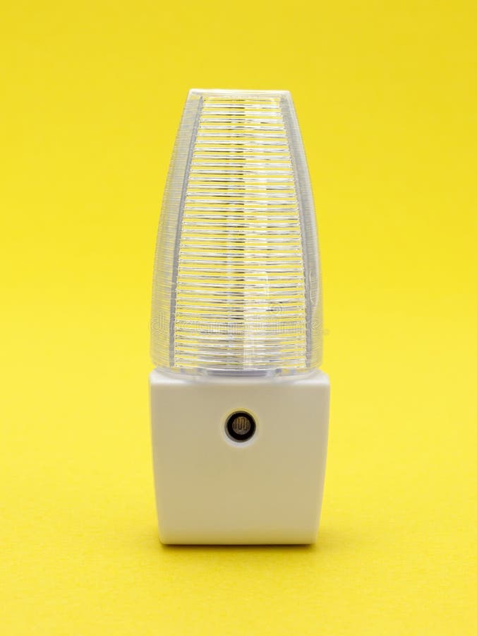 Generic LED Night Light on a Yellow Background. Stock Image - Image of ...