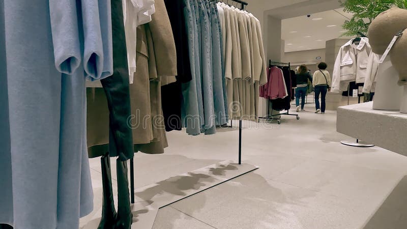 Generic Modern Clothes Store and Unrecognizable Customers, Dolly Shot ...