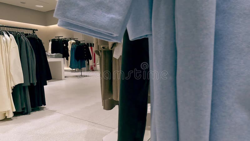 Generic Modern Clothes Store and Unrecognizable Customers, Dolly Shot ...