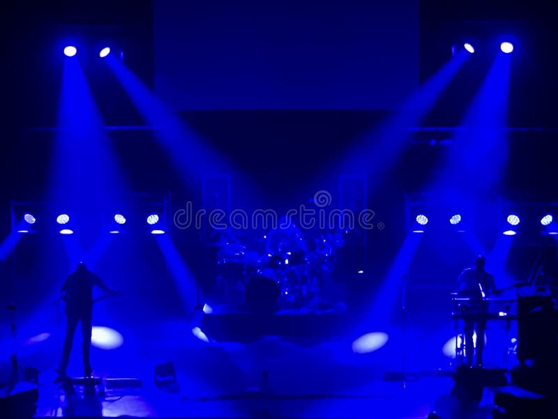A Generic Rock Band Performs Under Blue Lighting Stock Image - Image of ...