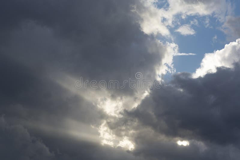 Genesis - Sun Rays Coming through the Clouds Stock Photo - Image of ...