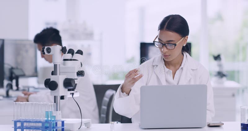 Scientist Biochemist Work with Scientific Instrument for ...