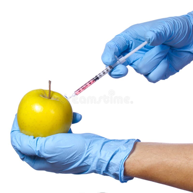 Genetic Injection into Apple Isolated on White Background. Genetically ...