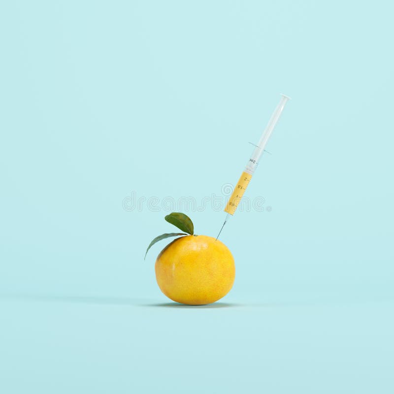 Genetically Modified Orange with Syringe on Blue Background Stock ...
