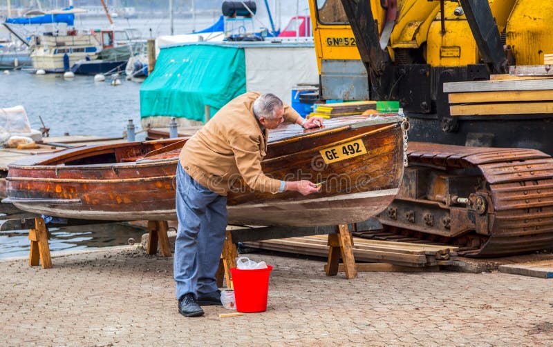 Geneva Waterfront View -Man Fixing Boat Editorial Stock Photo - Image ...