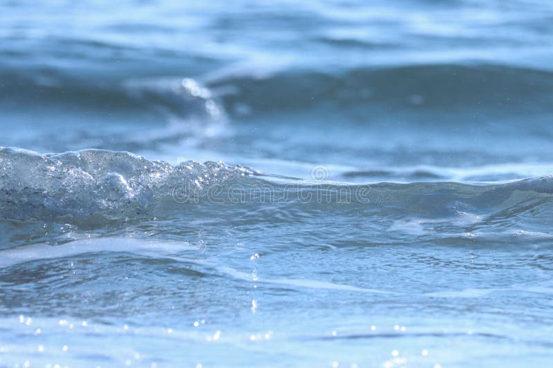 Gentle Ocean Waves with Sparkling Sunlight. Stock Image - Image of ...