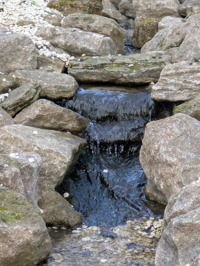 A Gentle Stone Stream with Rocks and Flowing Water Stock Image - Image ...