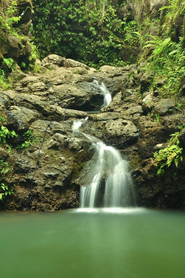 Gentle Waterfall Flows Over Rocks in Hawaii Stock Image - Image of ...