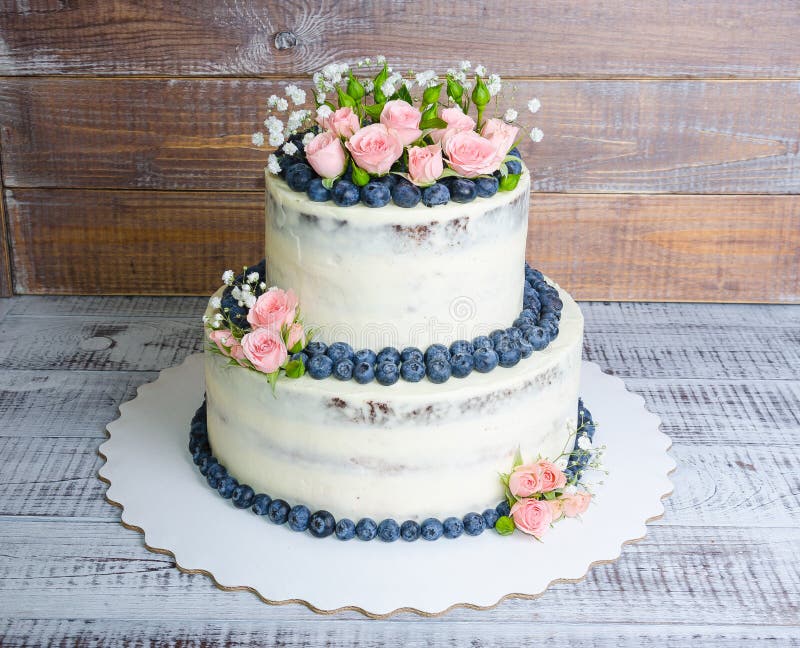 Gentle Wedding Cake with Blueberry and Roses Stock Image - Image of ...