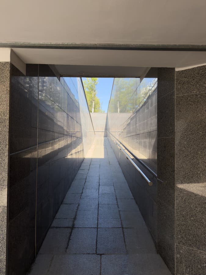 Gently Inclined Pedestrian Ramp with Smooth Granite Surface and ...