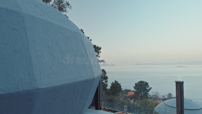 Dome Structure Overlooking a Coastal Landscape with Trees and Distant ...