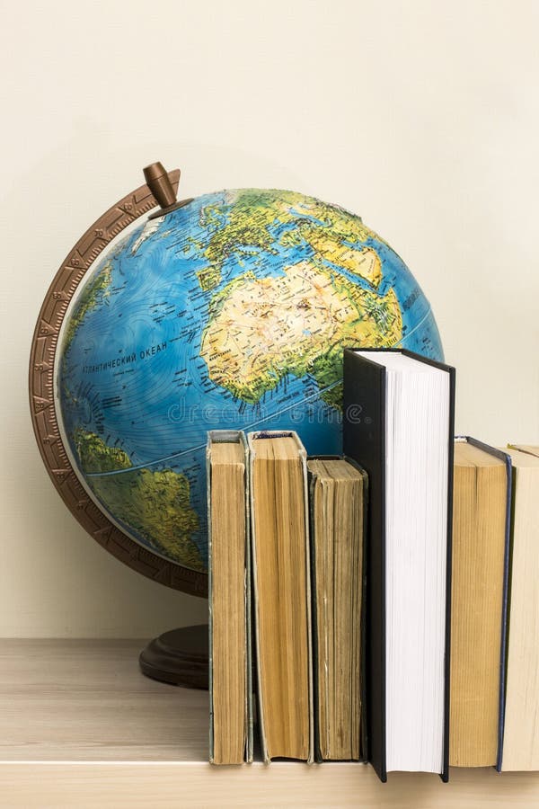 Geographic globe and books stock photo. Image of binding - 105690058